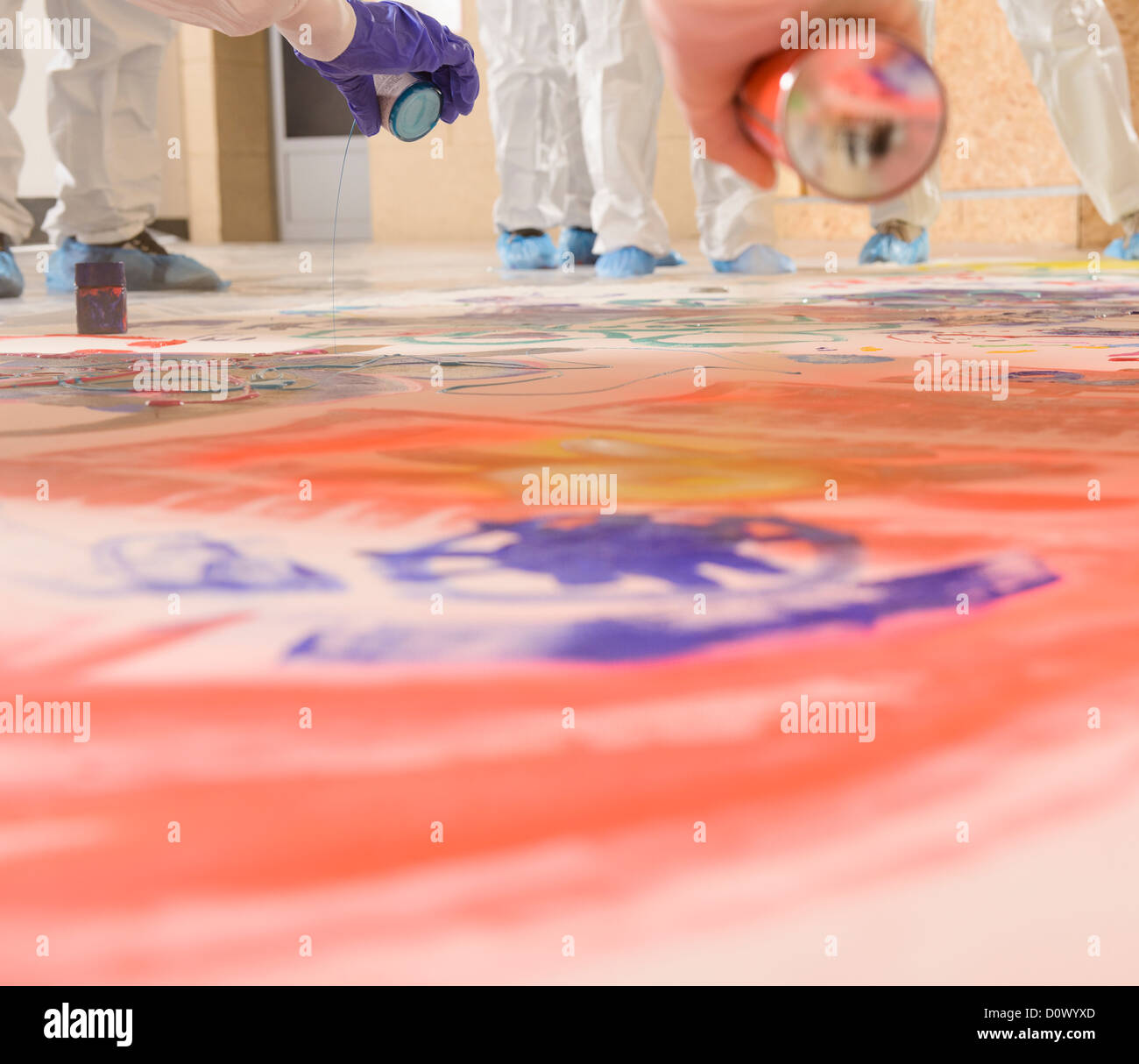 People having fun during art therapy session drawing paint Stock Photo ...