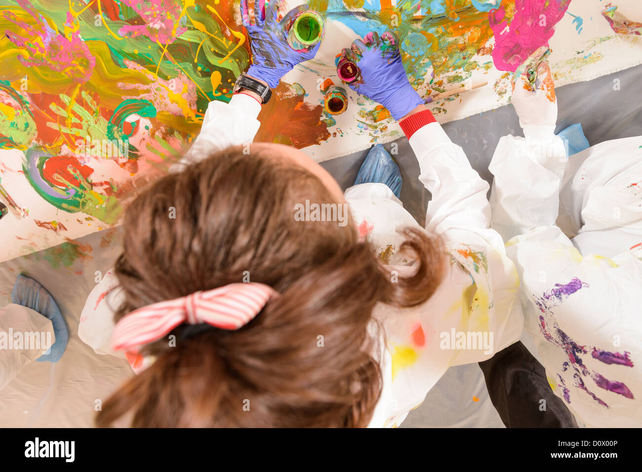 People having fun during art therapy session drawing paint Stock Photo ...