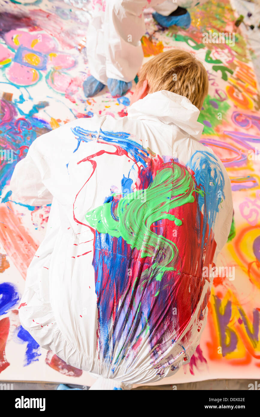 People having fun during art therapy session drawing paint Stock Photo ...