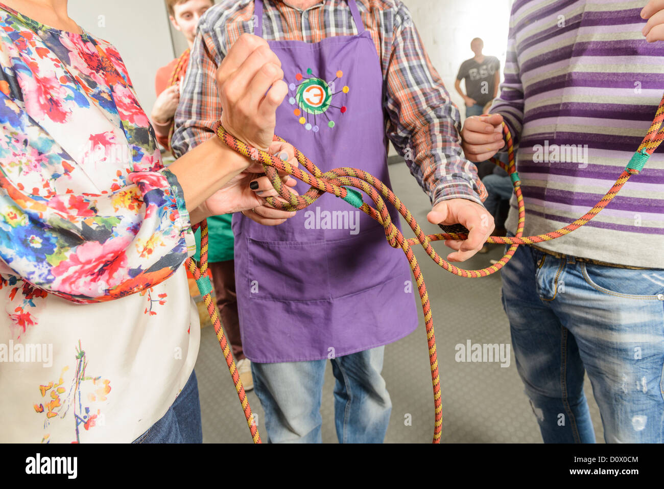 game rope fun activity office workers Stock Photo - Alamy