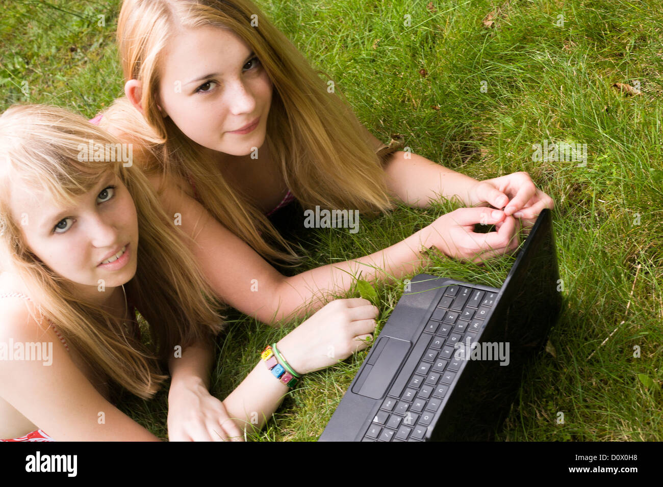 Two girls are having fun in the summer sun Stock Photo - Alamy