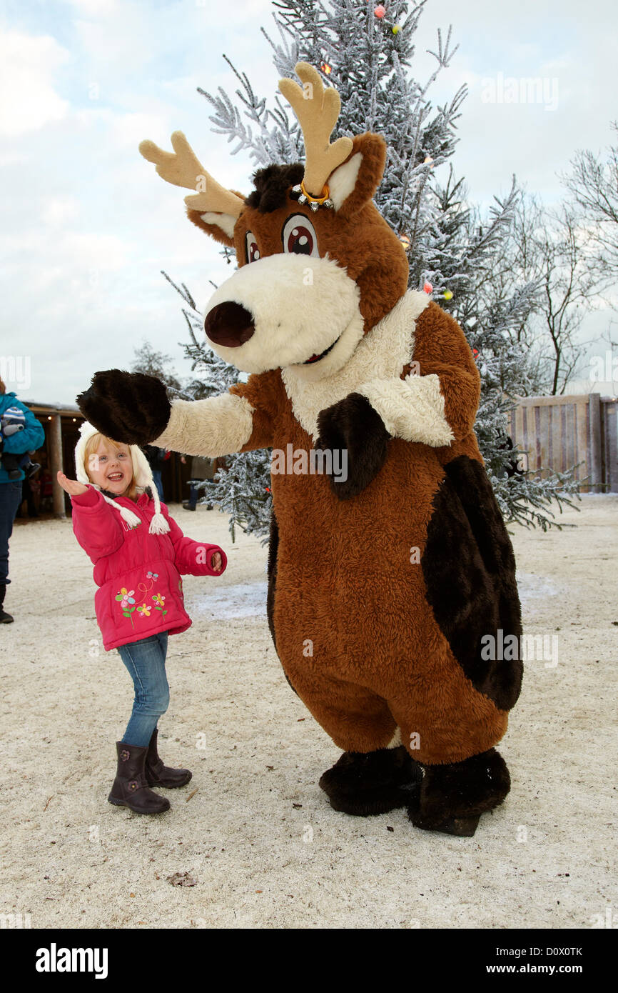 Children meet reindeer characters in the Elf village. Lapland UK, Bewl ...
