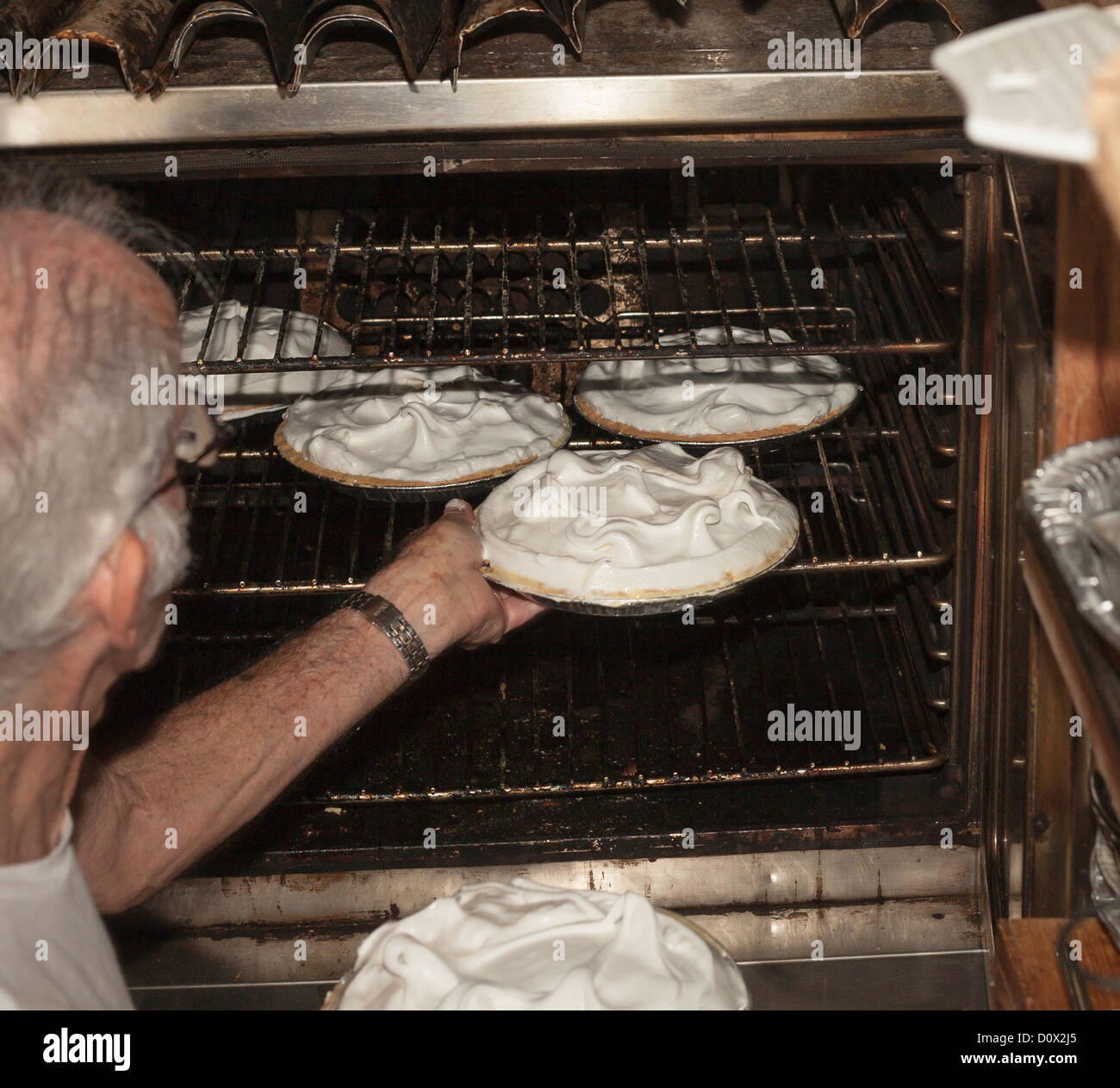 Into the Oven for browning. Key Lime Pies, prepared for baking are ...