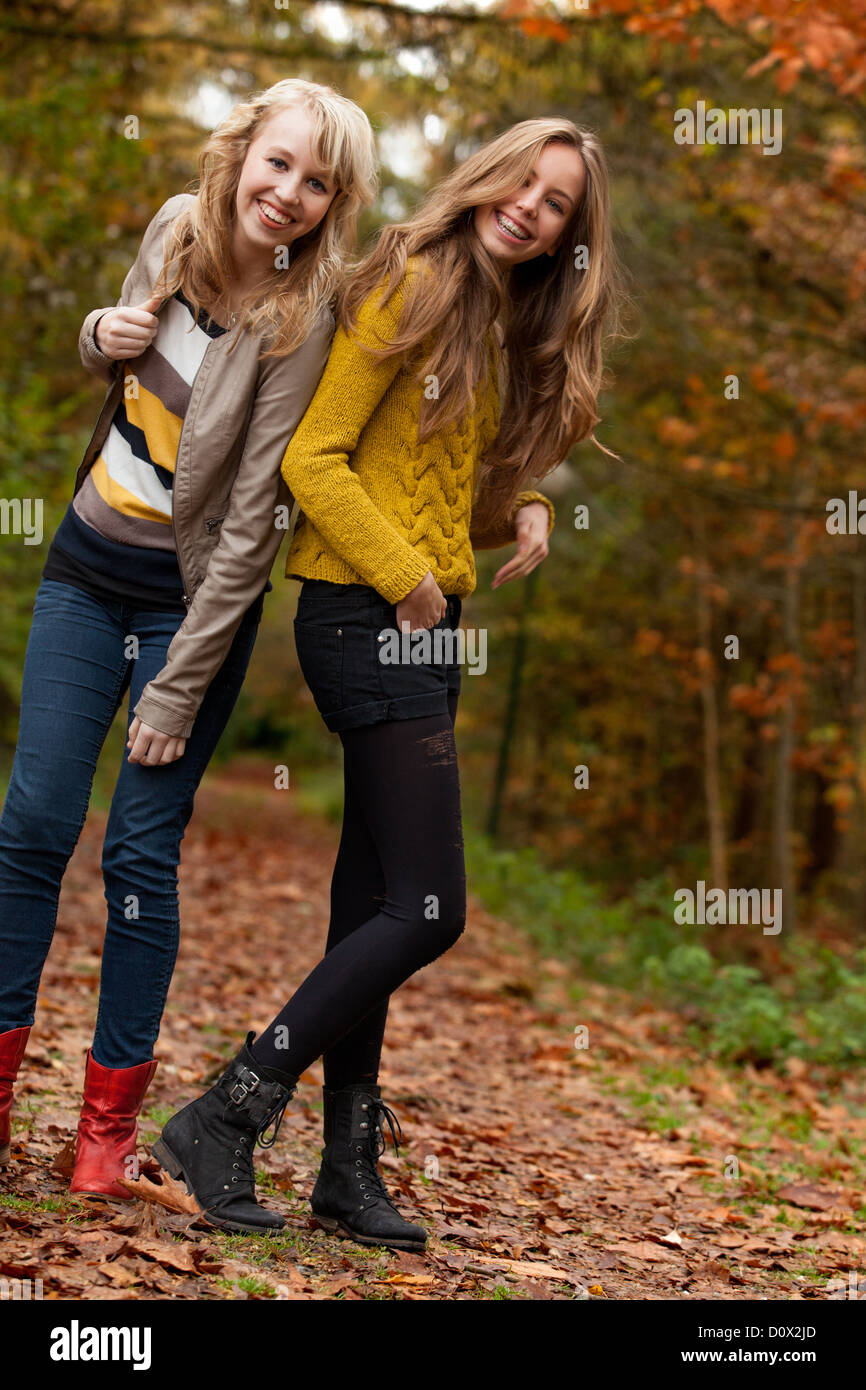 2 girls are having fun in the forest Stock Photo - Alamy