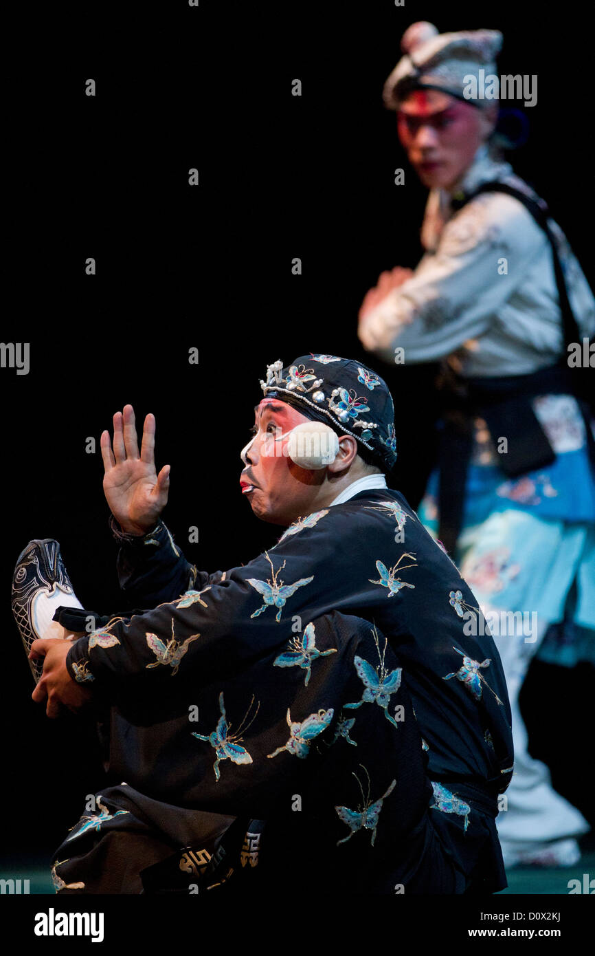 Two male characters jousting in traditional costumes during a ...