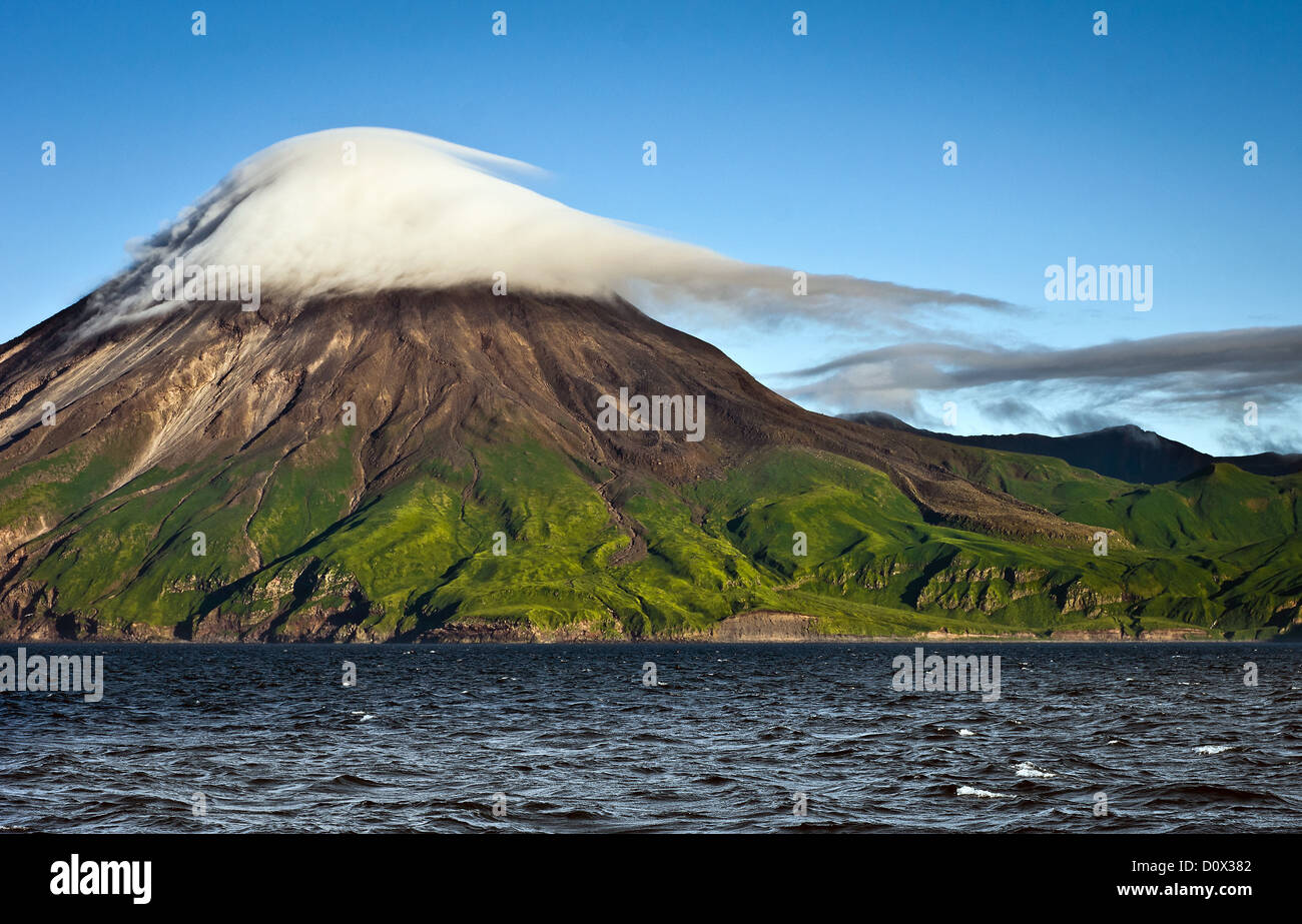 Beautiful Alaskan island landscape with cloud over mountain and sea ...
