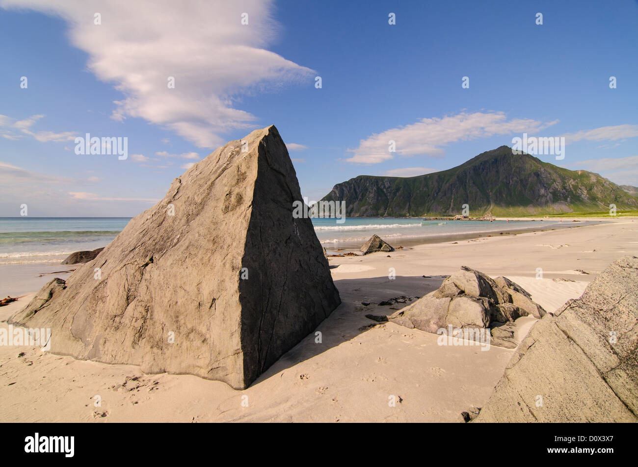 Rocks on a sandy beach near Fredvang on the Lofoten Islands in Norway ...
