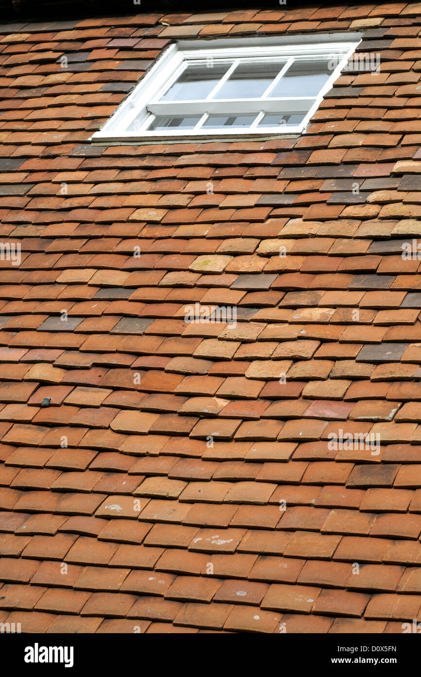 Clay tile hung wall and small window Stock Photo - Alamy