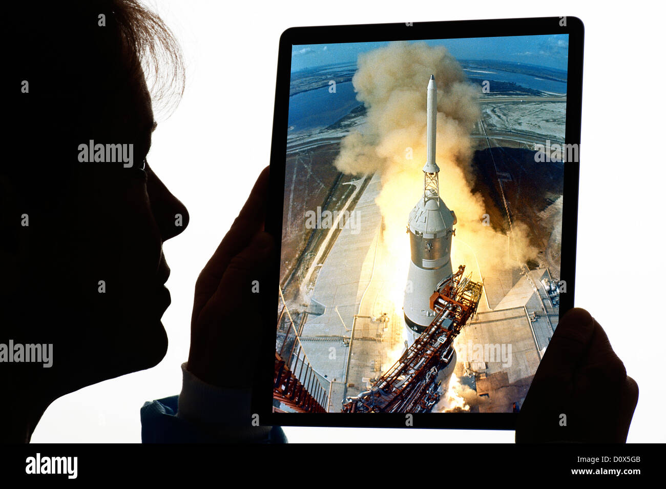 woman engineer with NASA shuttle launch photo on digital tablet Stock ...