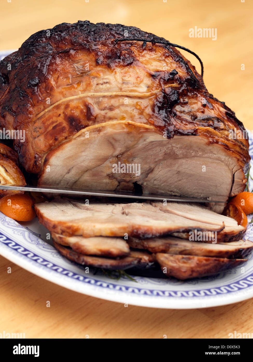 Roast leg of pork rolled boned glazed Stock Photo - Alamy