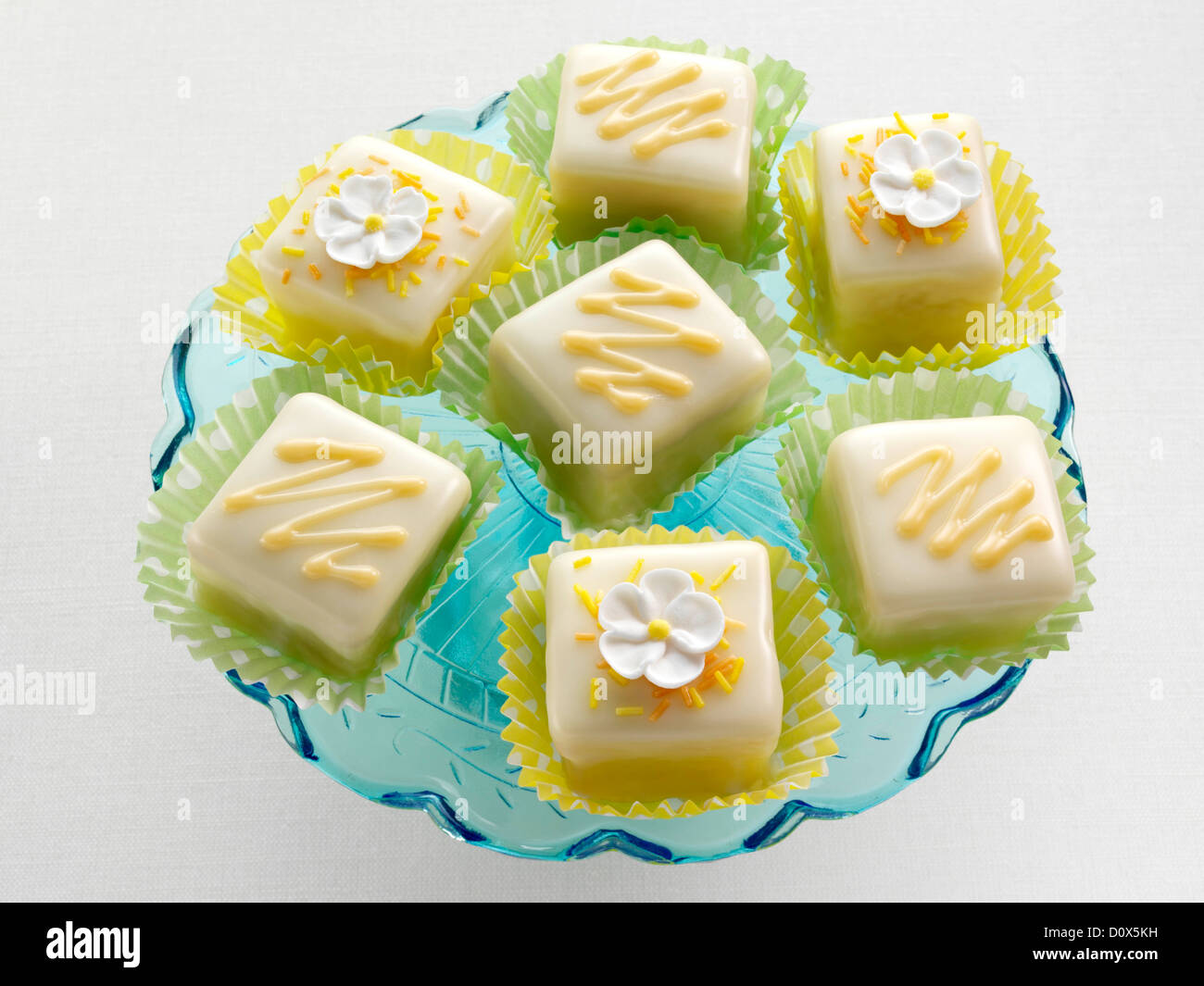 Frosted decorated fondant fancies individual cakes hi-res stock ...