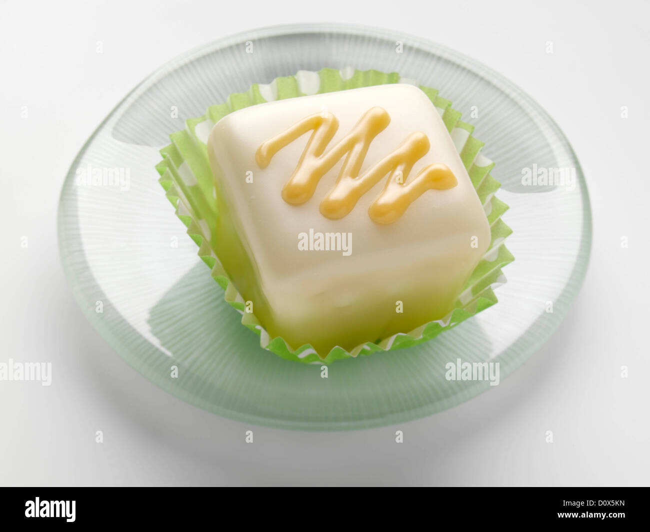 Frosted decorated fondant fancies individual cakes hi-res stock ...
