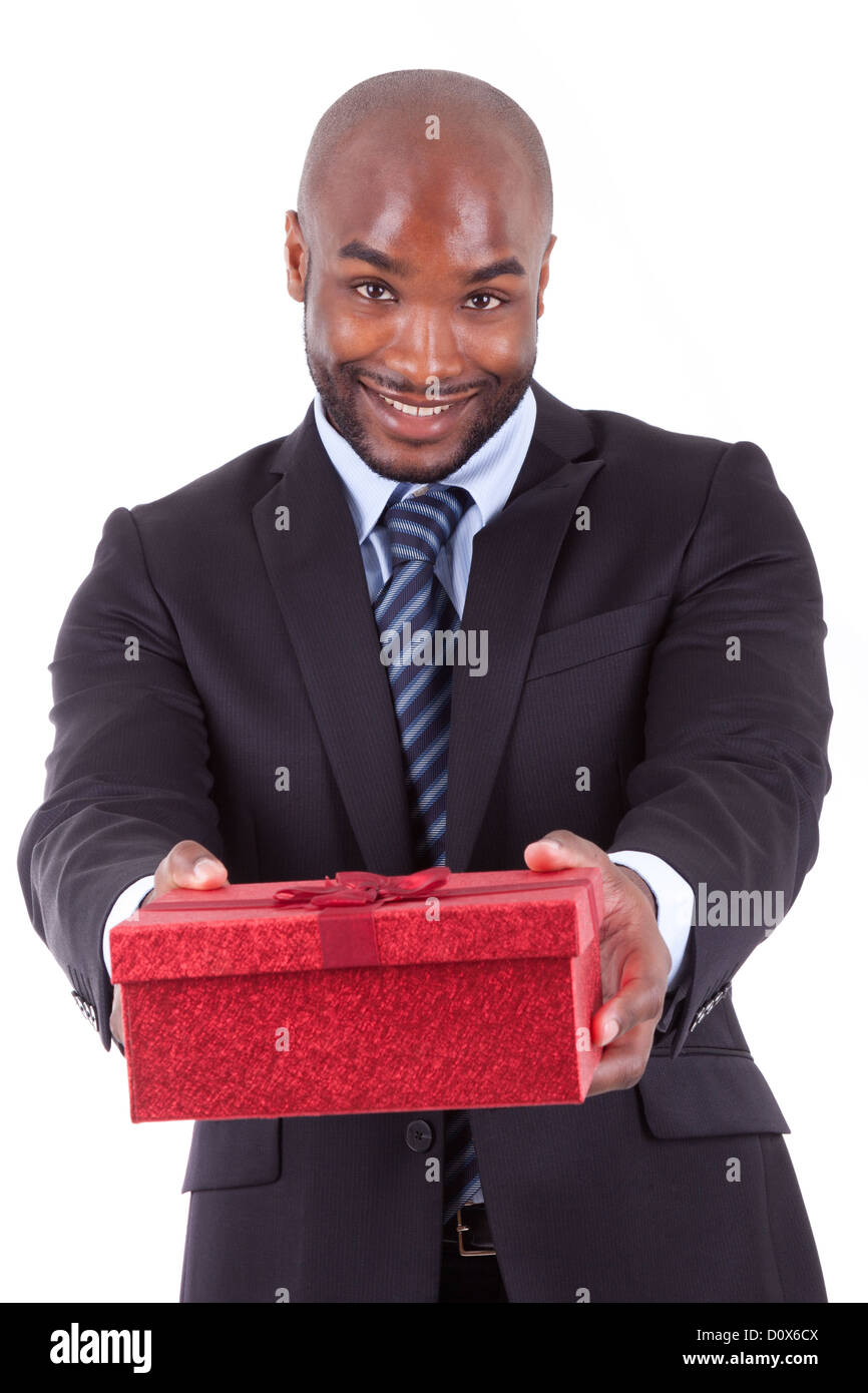 Young African American man offering a gift, isolated on white ...