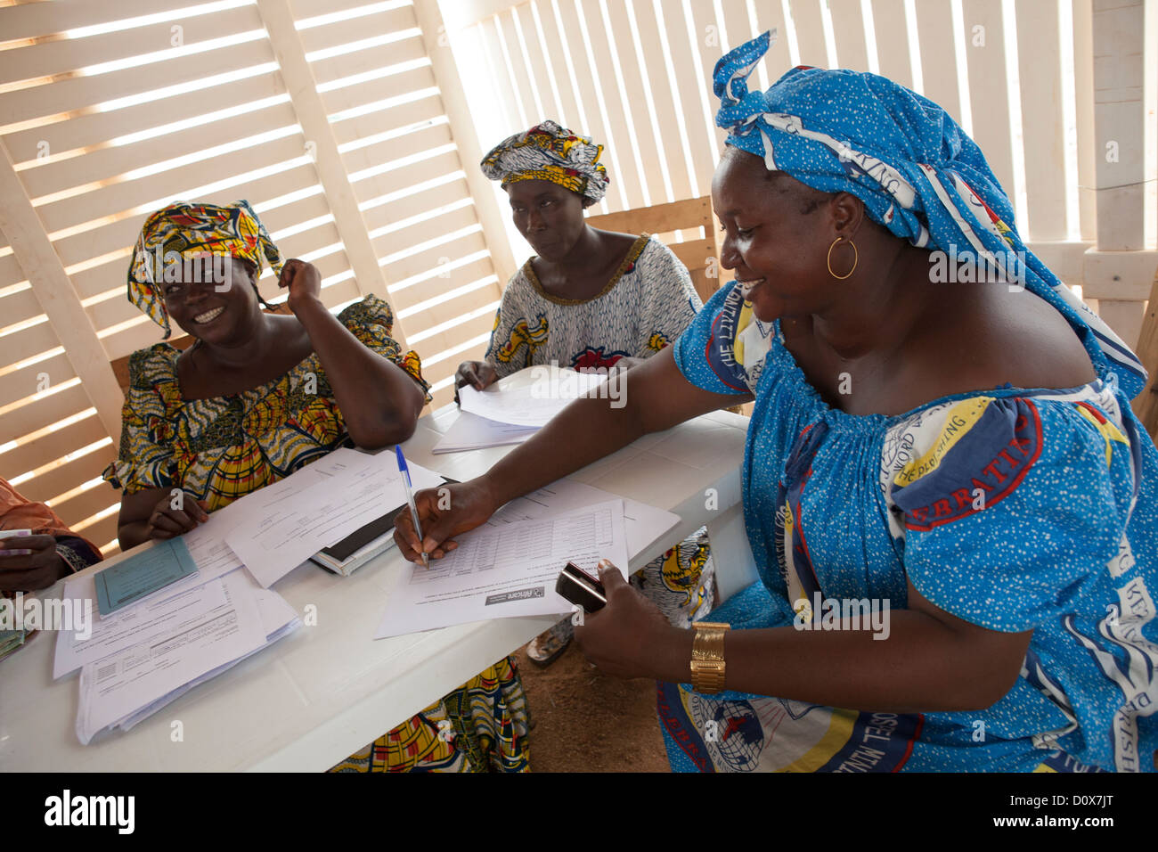A woman signs for a microfinance loan in Doba, Chad, Africa Stock Photo ...