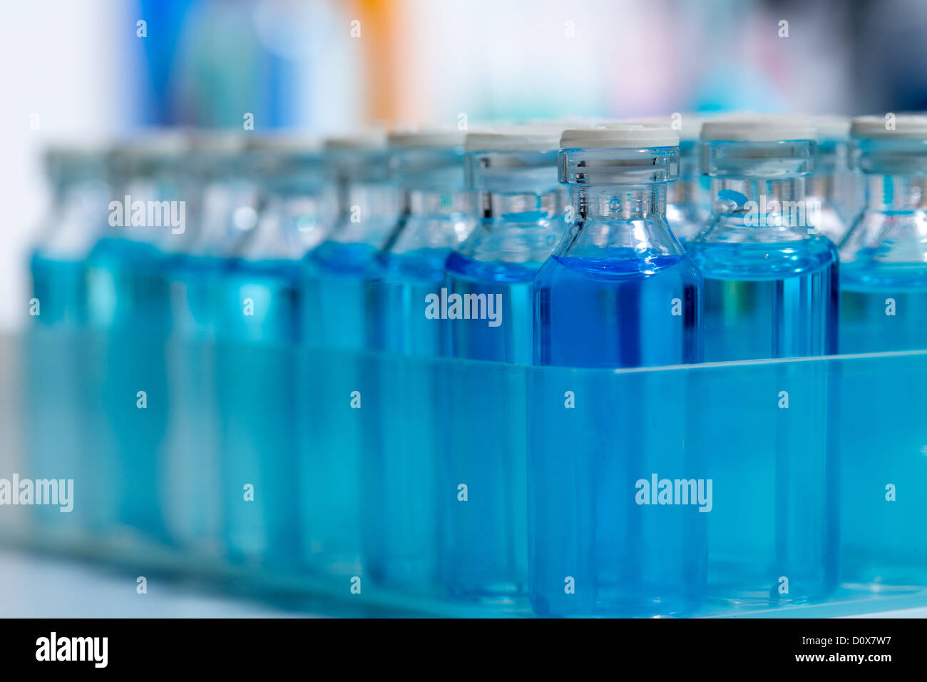 Chemical scientific laboratory stuff test tube and blue glass bottles ...