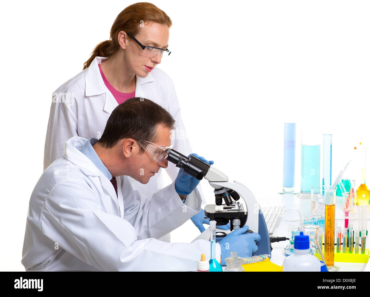 chemical laboratory with two scientist working with test tubes and ...