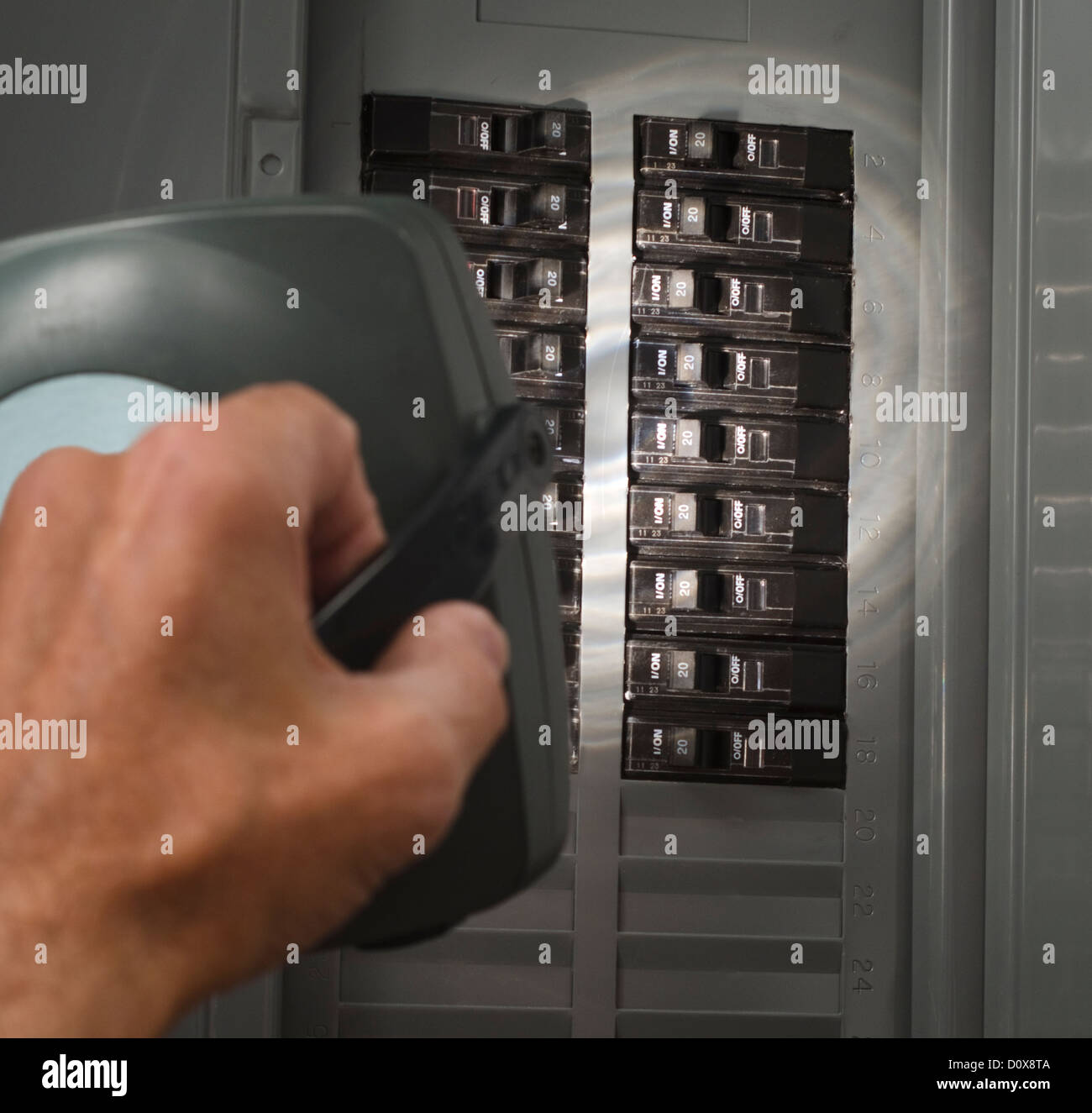 man examining circuit breakers at residential service panel Stock Photo ...