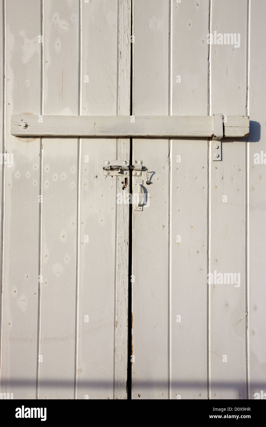 A latch that secures the door to an older building Stock Photo - Alamy