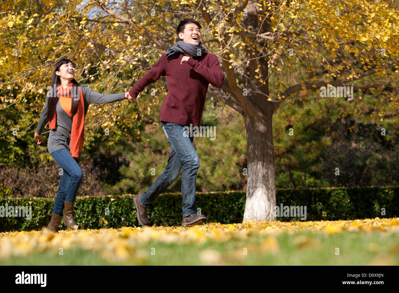 Couple running away on meadow hi-res stock photography and images - Alamy