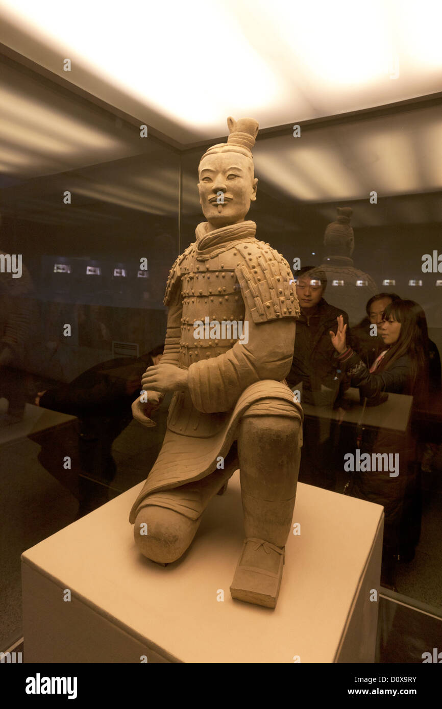 Visitors examine terracotta statue, part of the army of terracotta ...