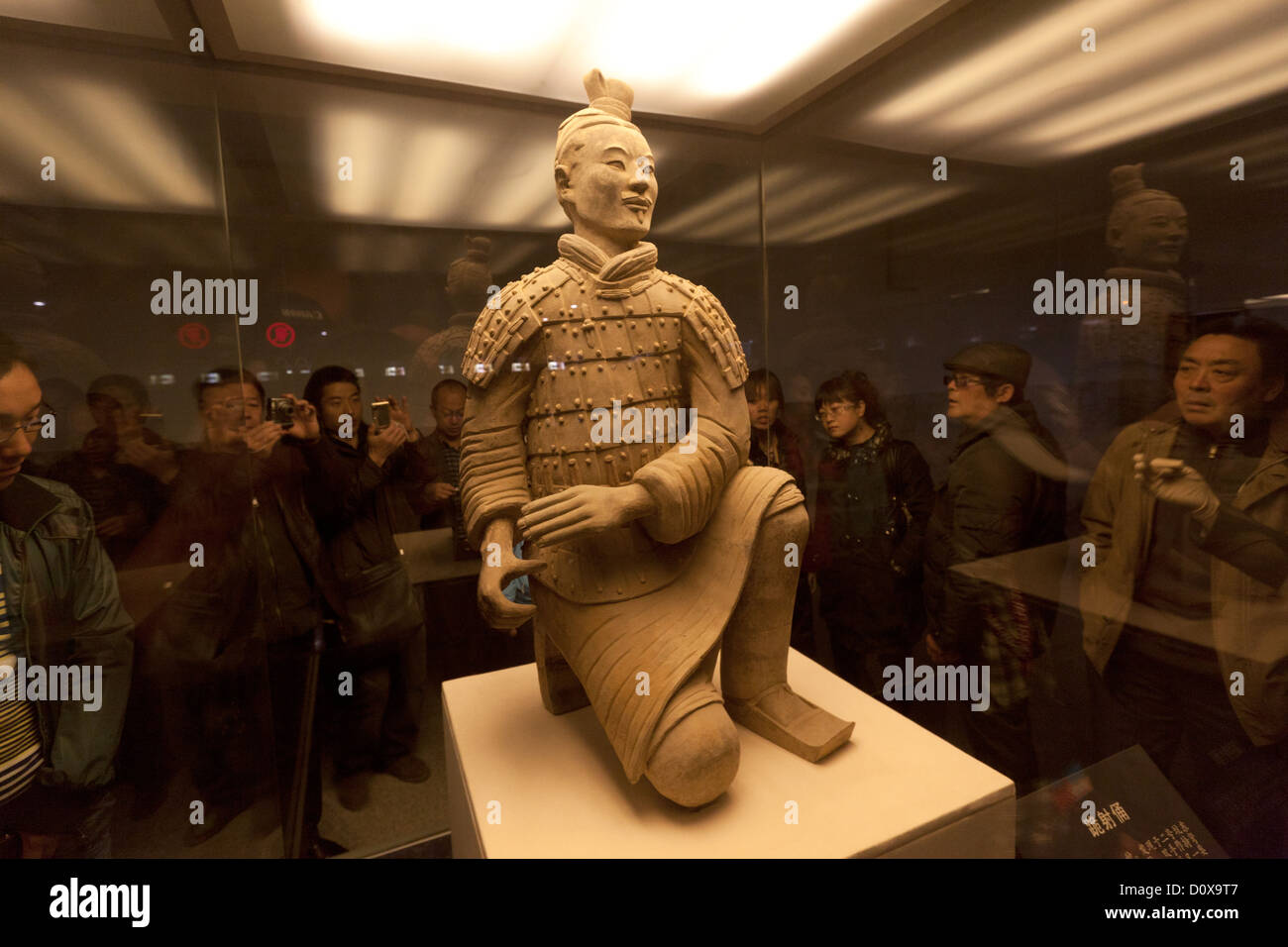 Visitors examine terracotta statue, part of the army of terracotta ...