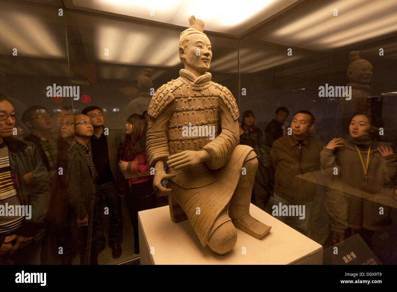 Visitors examine terracotta statue, part of the army of terracotta ...