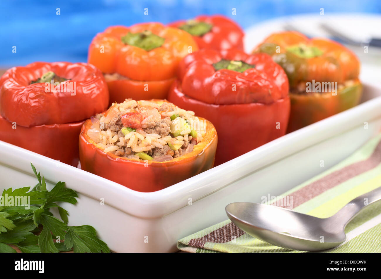Baked stuffed red bell pepper filled with minced meat, onion, rice ...