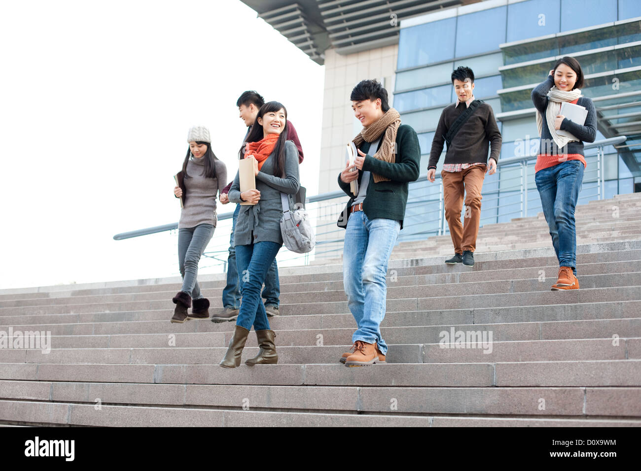 Young college students walking down steps of university building Stock ...