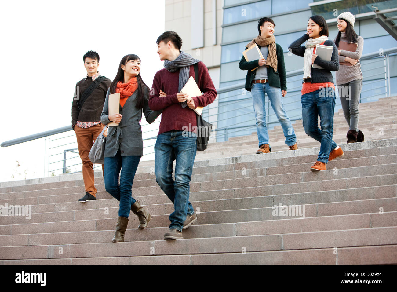 Young college students walking down steps of university building Stock ...