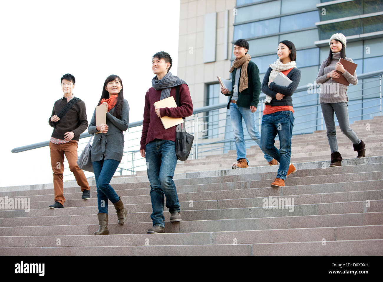 Young college students walking down steps of university building Stock ...