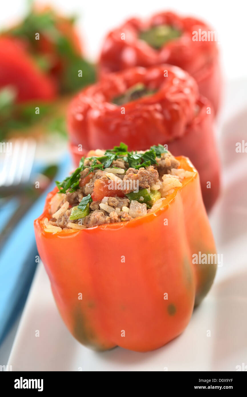 Baked stuffed red bell pepper filled with ground meat, onion, rice ...