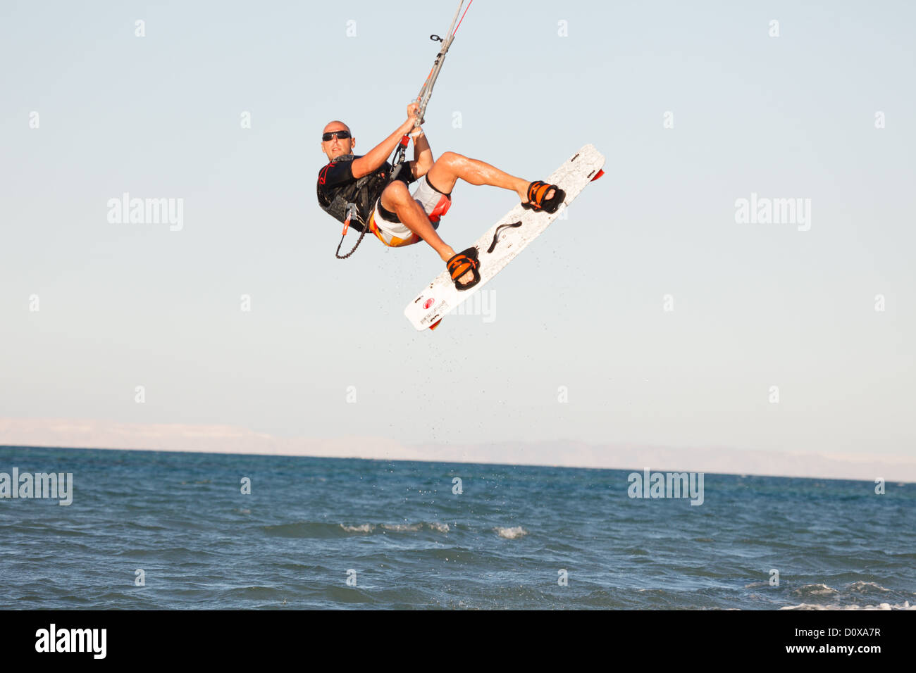 Man surfing in sea clear sky active hi-res stock photography and images ...