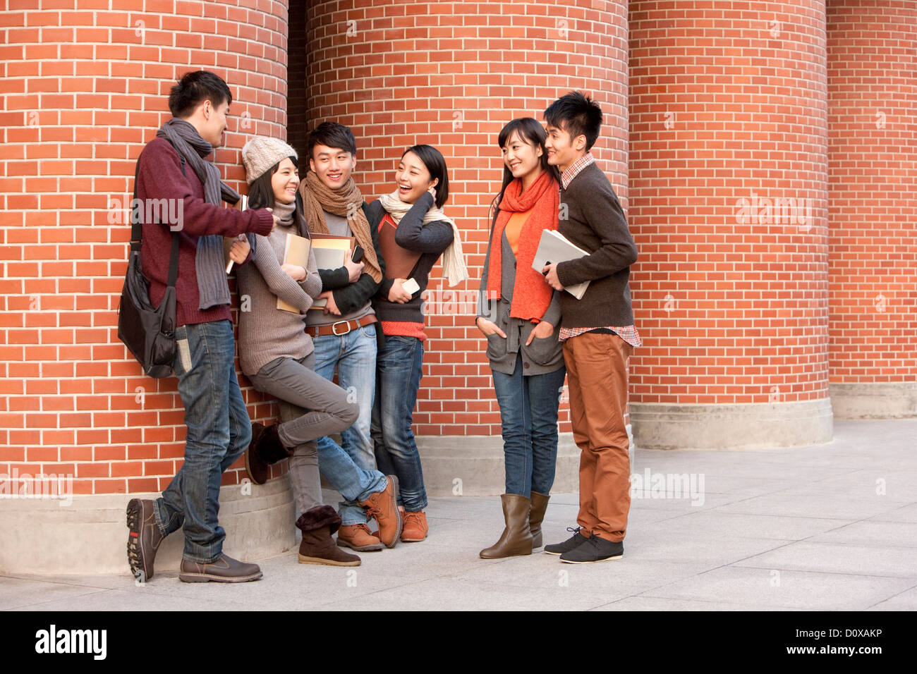 College students chatting in front of a university building Stock Photo ...