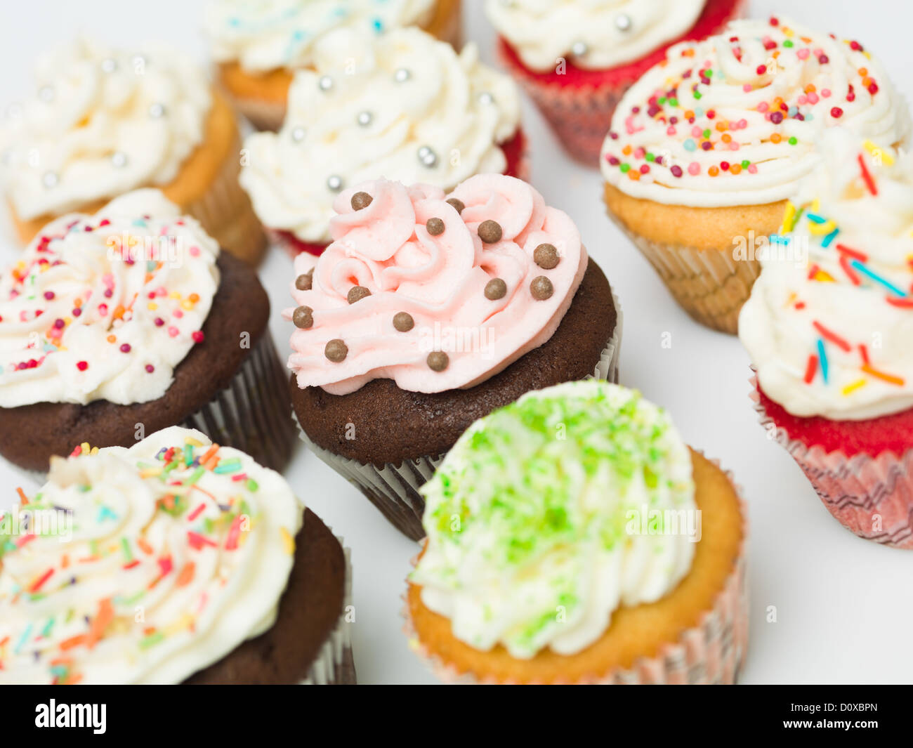 group of multicolored ornate details muffins white background Stock ...