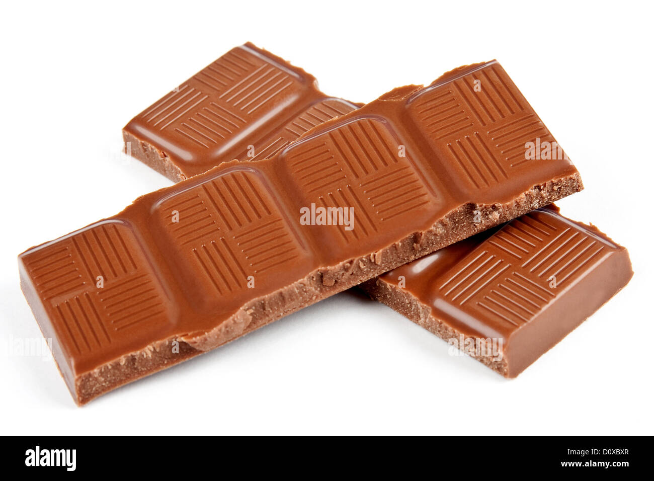 Blocks of chocolate isolated on white background Stock Photo - Alamy