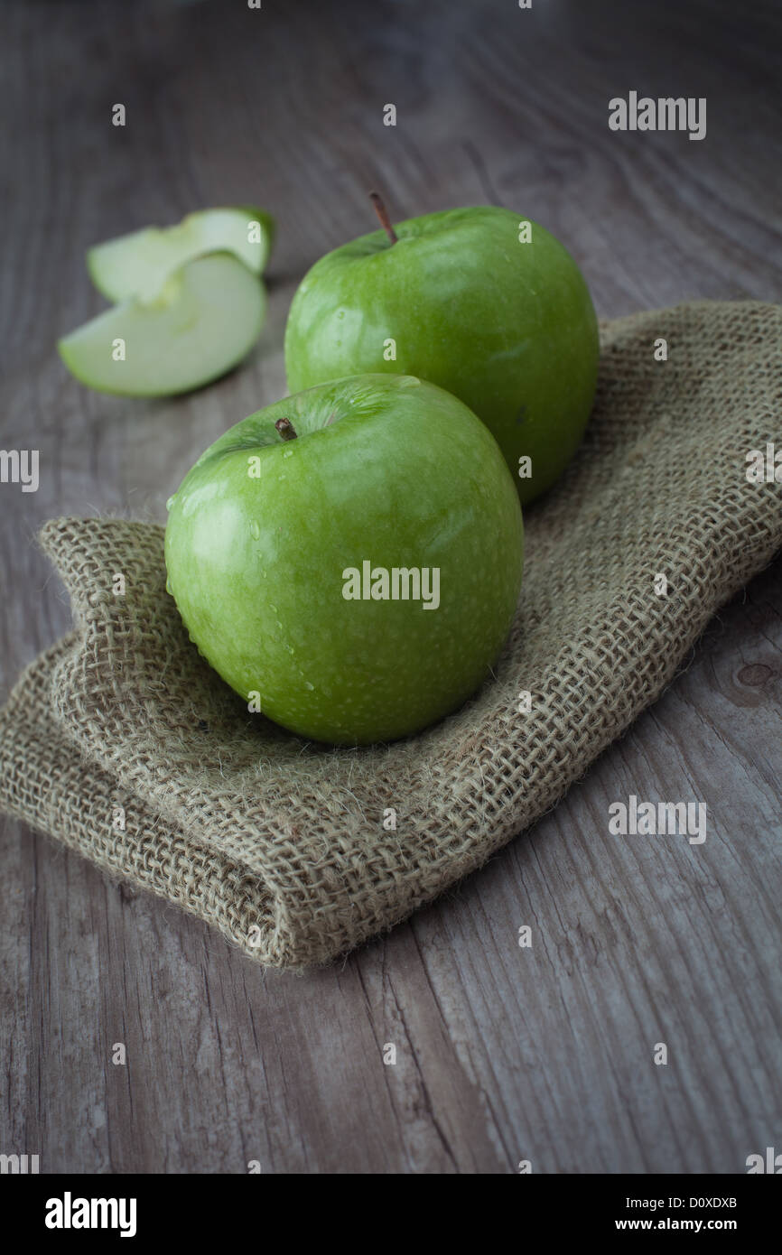 Bunch of fresh healthy green apples on a wooden background Stock Photo ...
