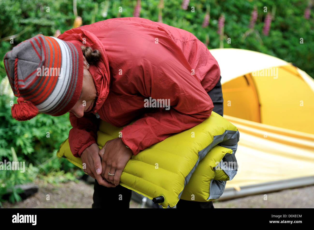 Woman deflates her sleeping pad at camp, Refugio Los Troncos, El ...