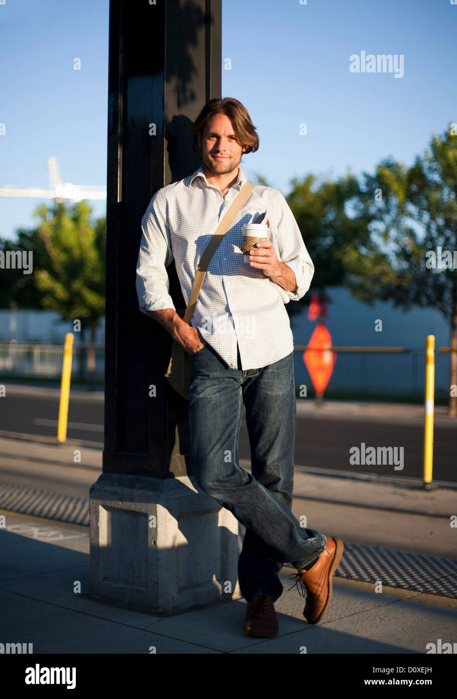 Men commuting in jeans hi-res stock photography and images - Alamy