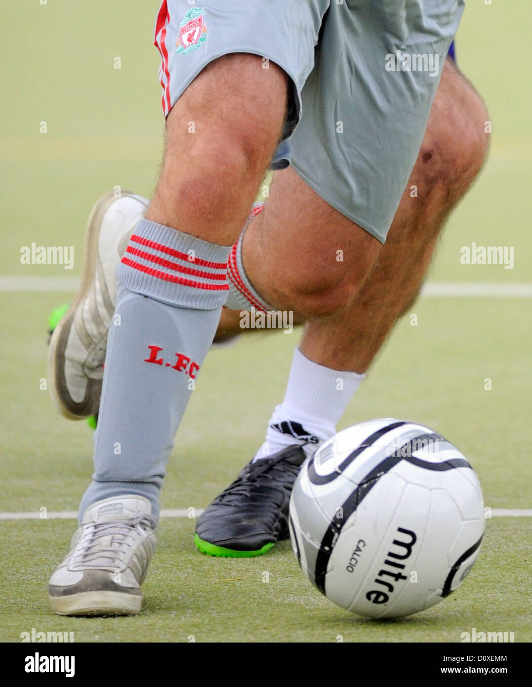 A cropped generic image of a football player controlling the ball Stock ...