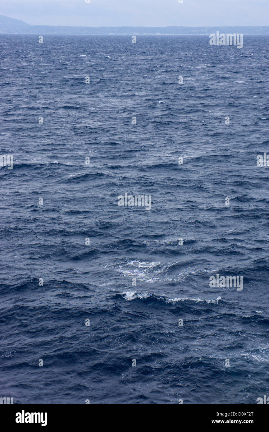 Blue sea with small waves, portrait format Stock Photo - Alamy