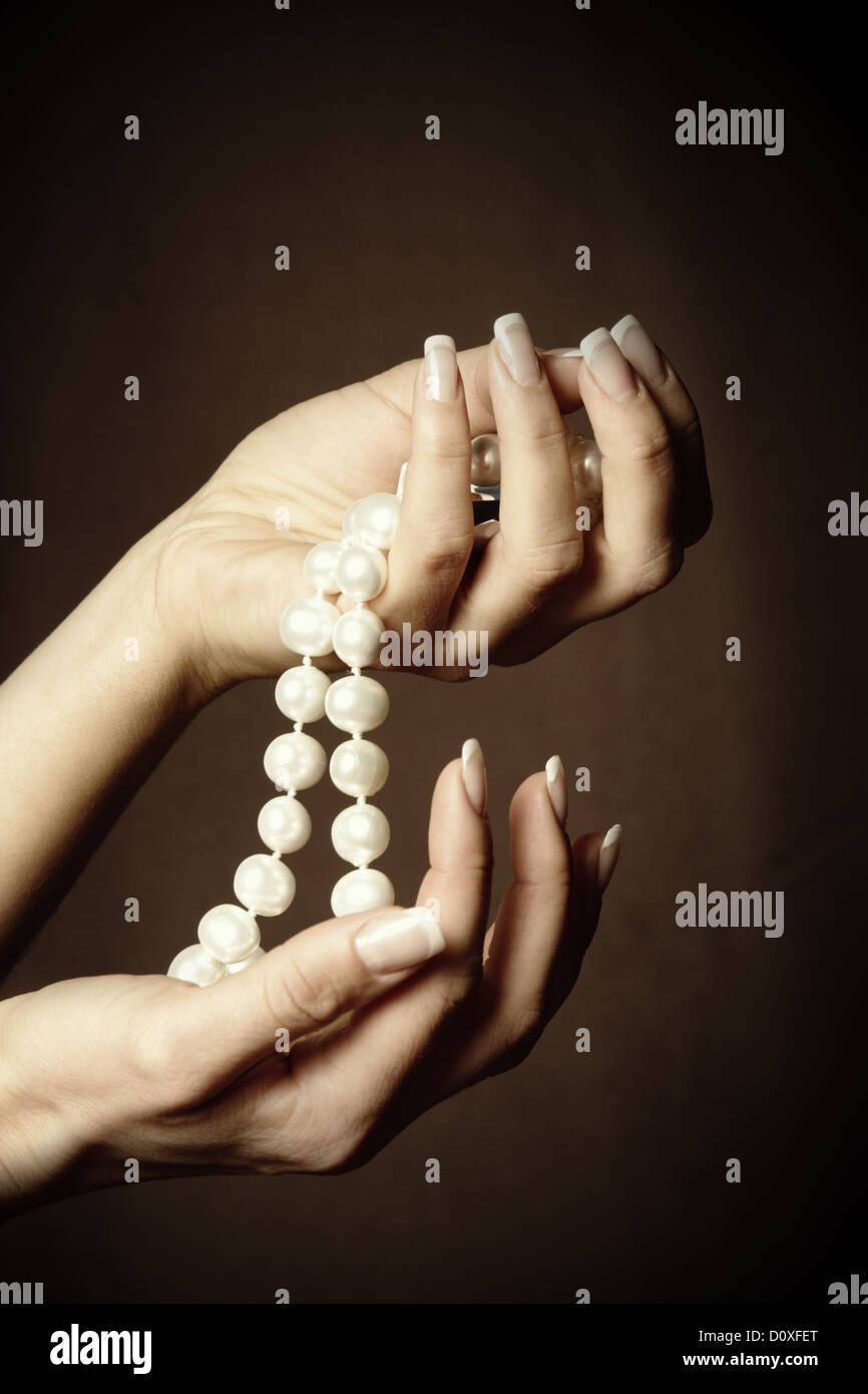 Pearl in hands Stock Photo - Alamy