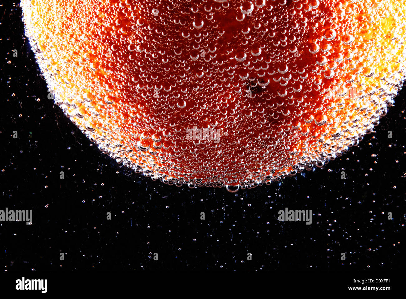 Orange in bubbles Stock Photo - Alamy