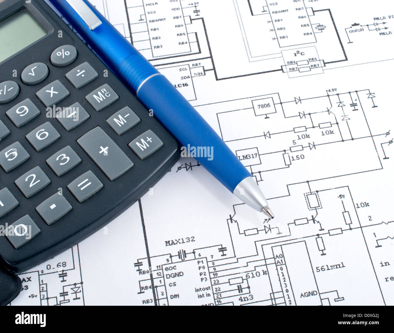 Calculator and pen on electrical diagram Stock Photo - Alamy