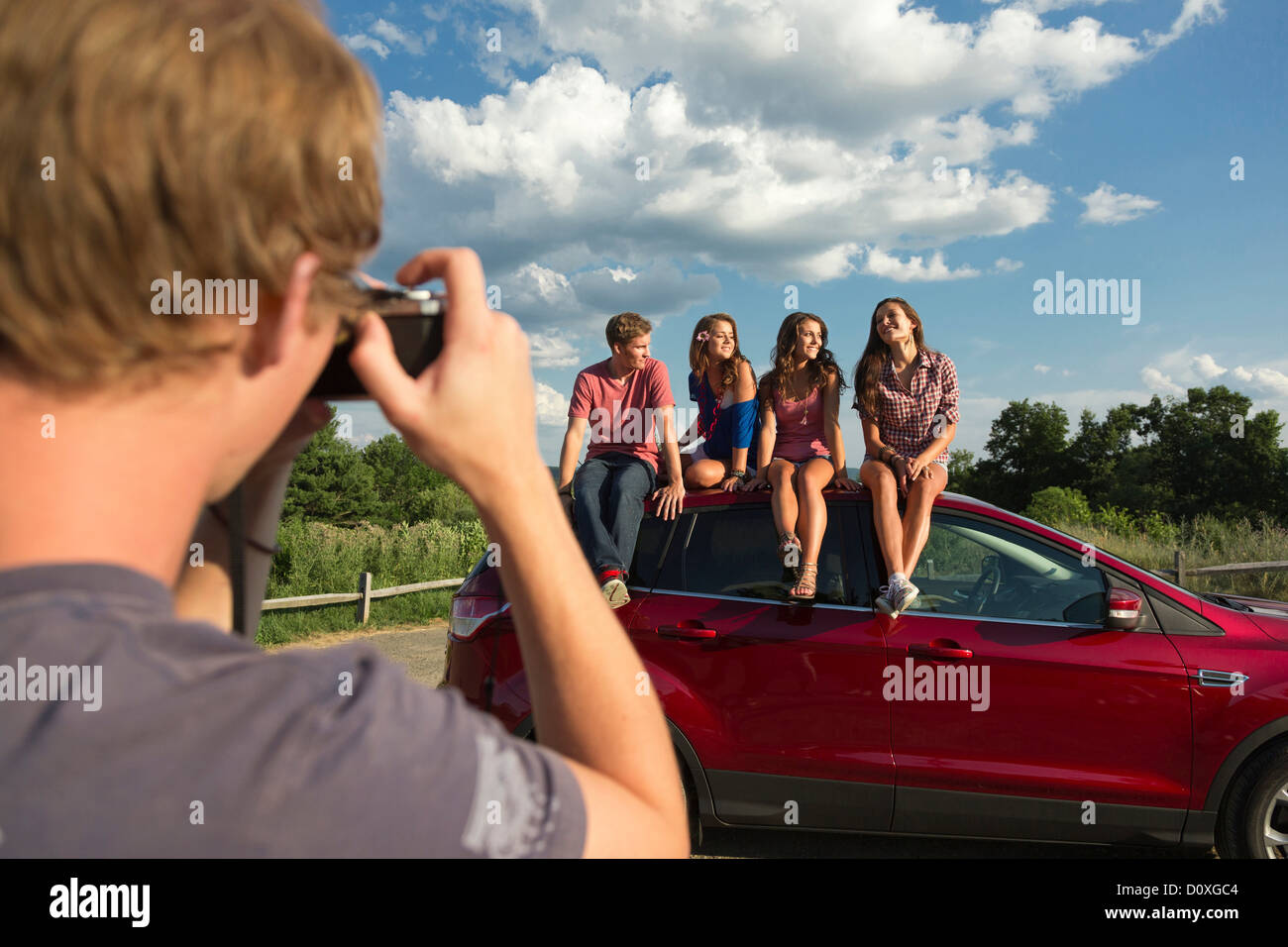 Girl On Car Roof High Resolution Stock Photography and Images - Alamy