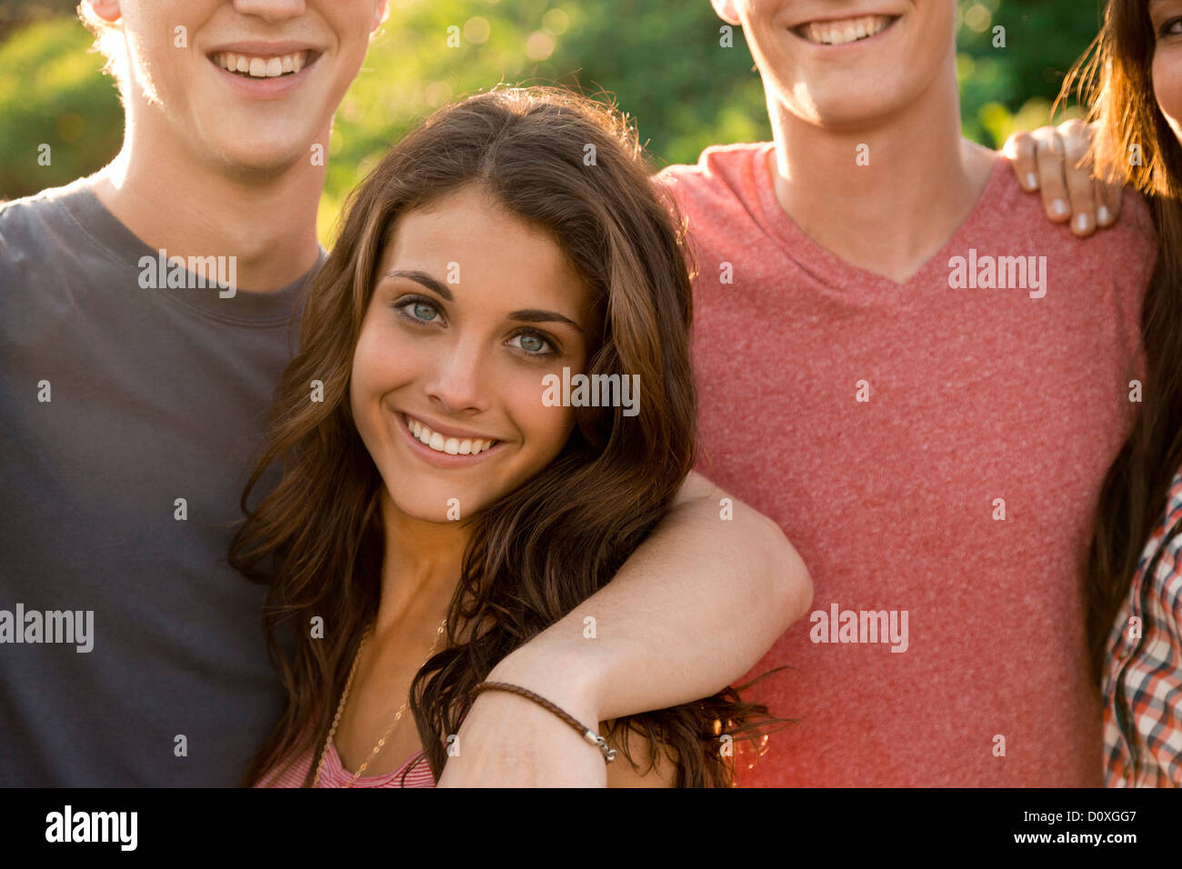 Portrait of friends with arms around each other Stock Photo - Alamy
