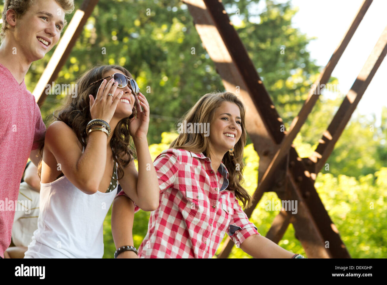 Three friends on bridge Stock Photo - Alamy