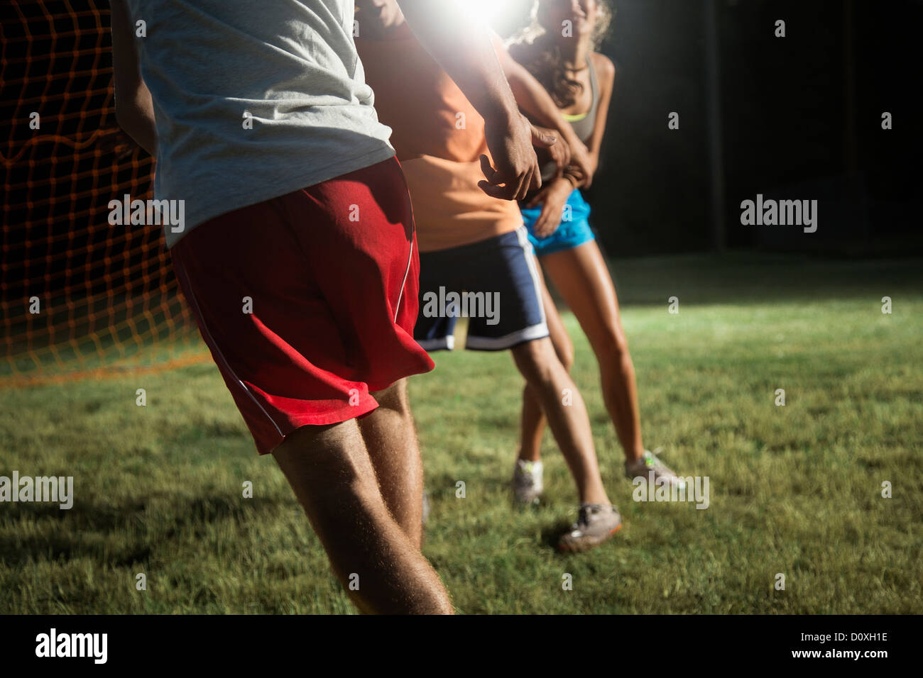 Friends playing soccer night hi-res stock photography and images - Alamy
