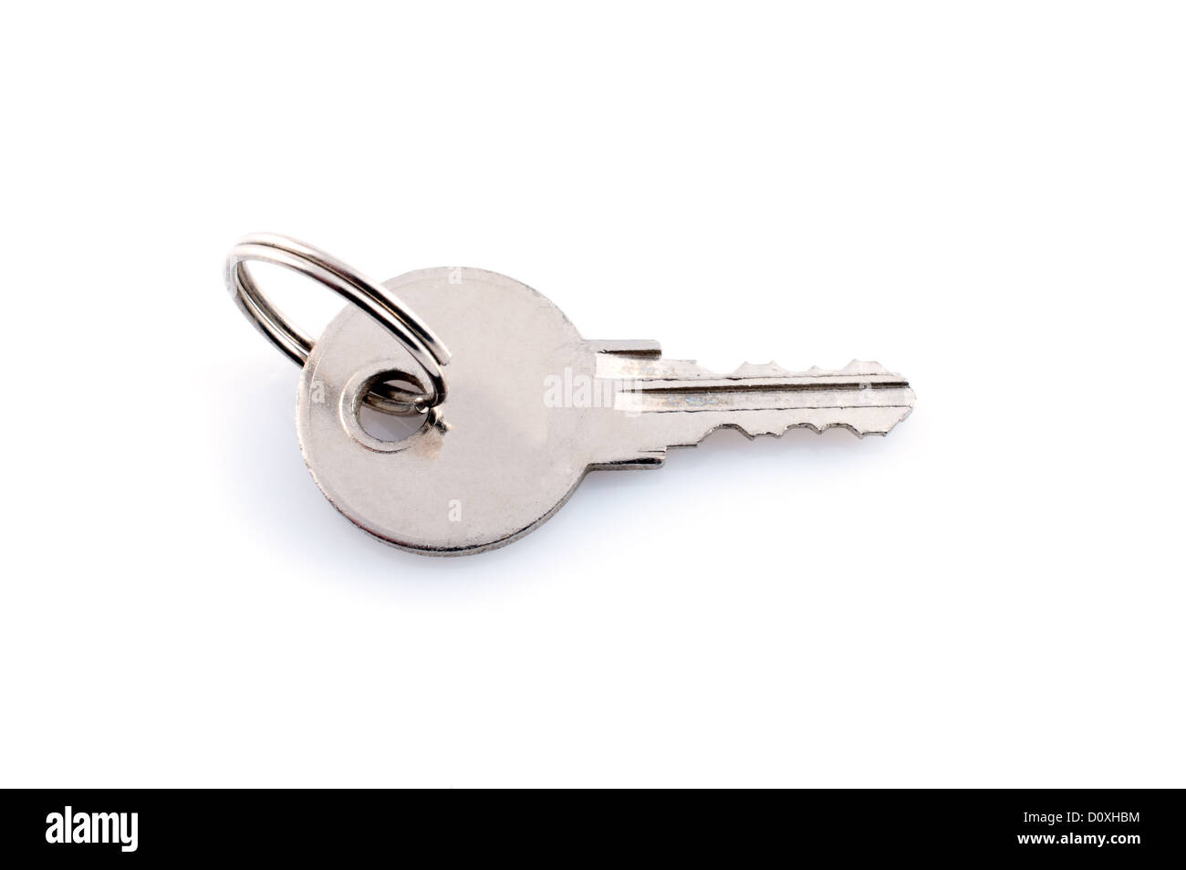 Metallic key. On white with shadow Stock Photo - Alamy