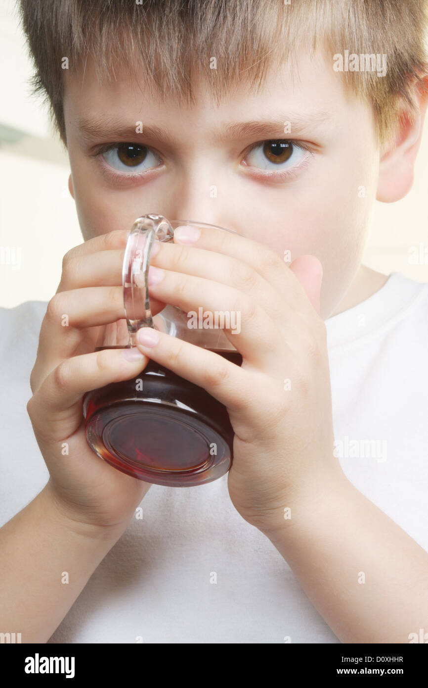 Cute boy drinking tea hi-res stock photography and images - Alamy