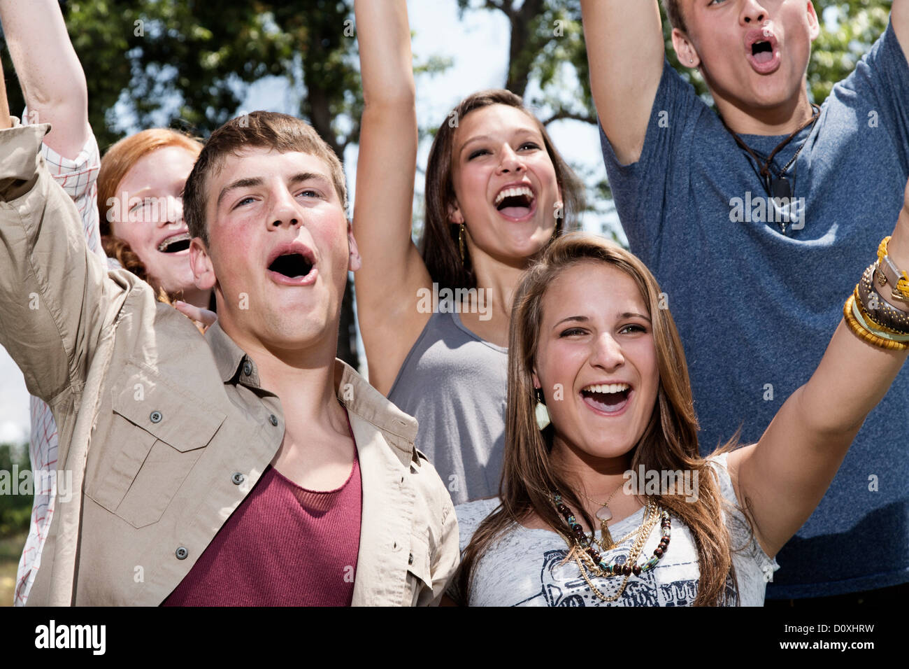 Five friends cheering, close up Stock Photo - Alamy